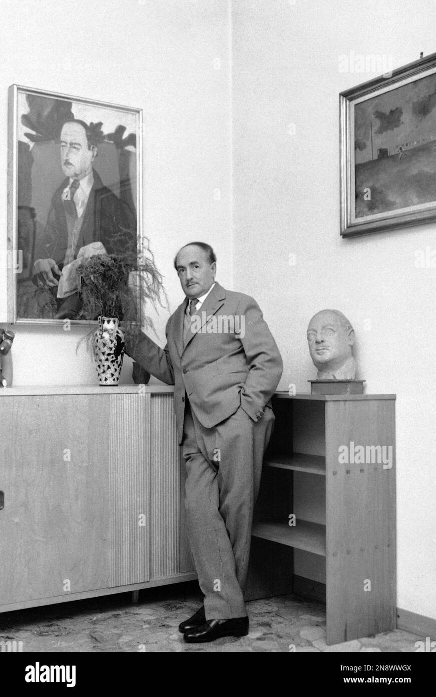 Salvatore Quasimodo, poet, author and translator, poses in the living ...