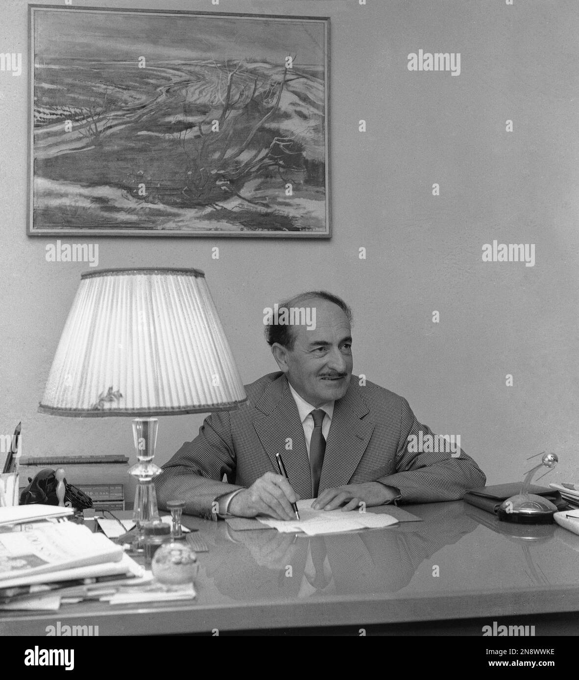Salvatore Quasimodo, poet and author, is shown at his desk at his Milan ...