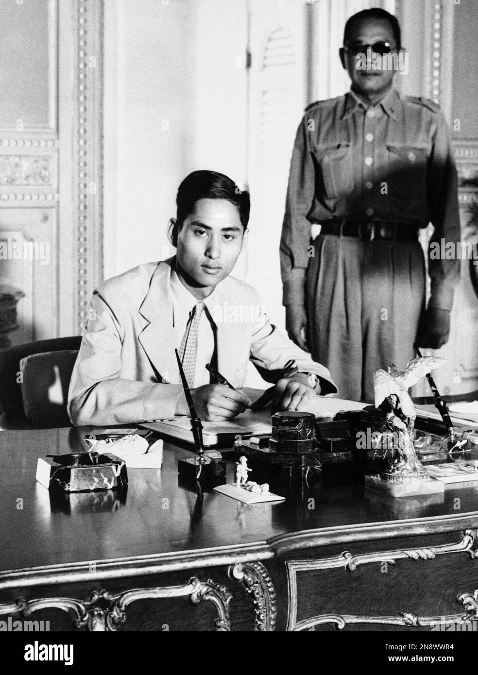 King Ananda Mahidol, who returned to Bangkok, Thailand , sits at his ...
