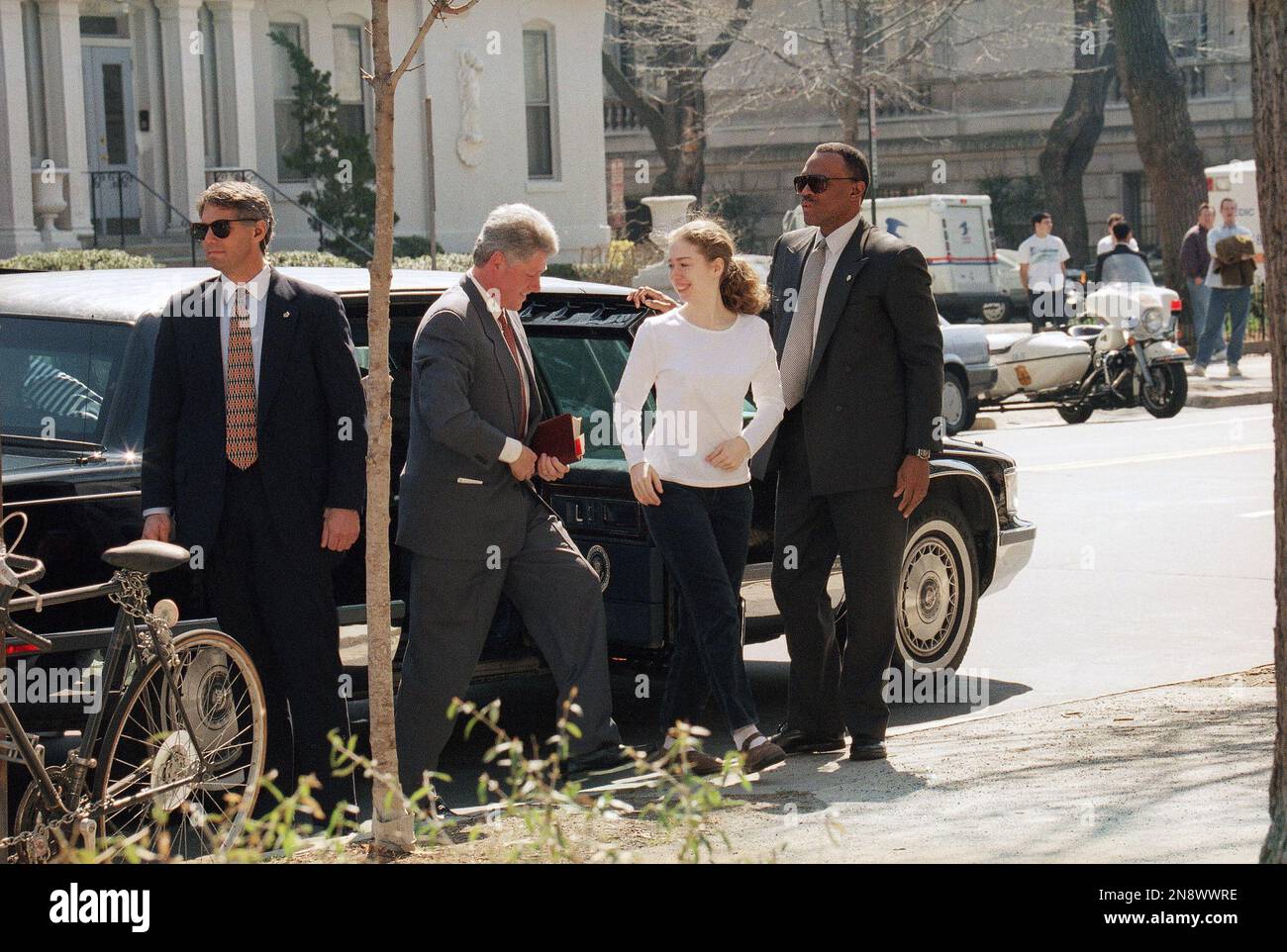 With Secret Service agents on either side, President Bill Clinton and ...