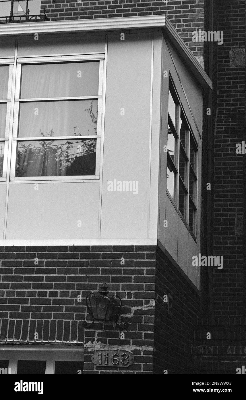 Bullet holes appear in the house across the street from the home of ...