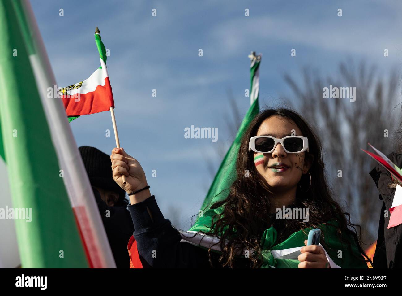 Washington, DC - February 11, 2023: A young girl waves a flag at the ...