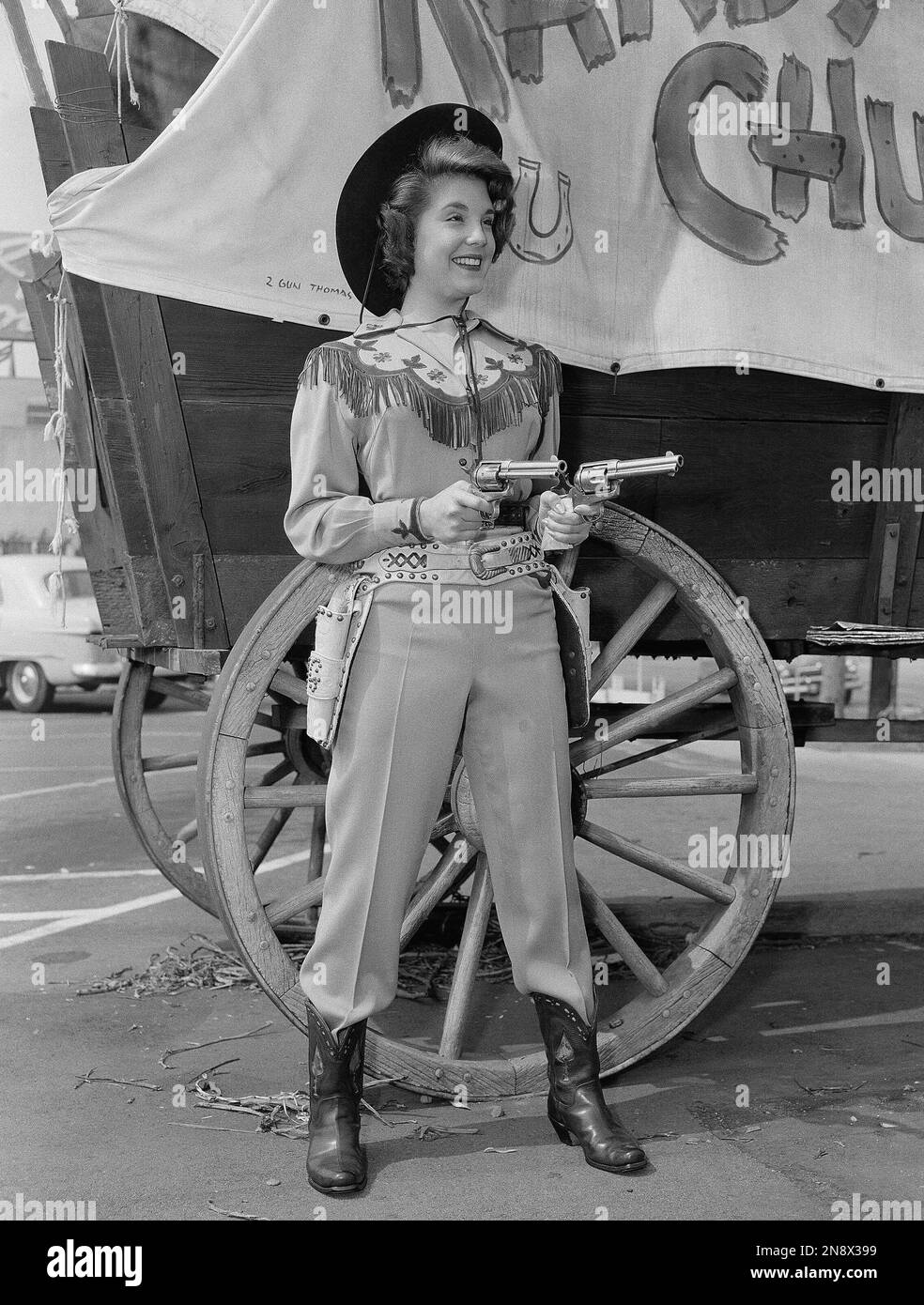 Karen Sharpe shows her way with a brace of six shooters as she handles ...