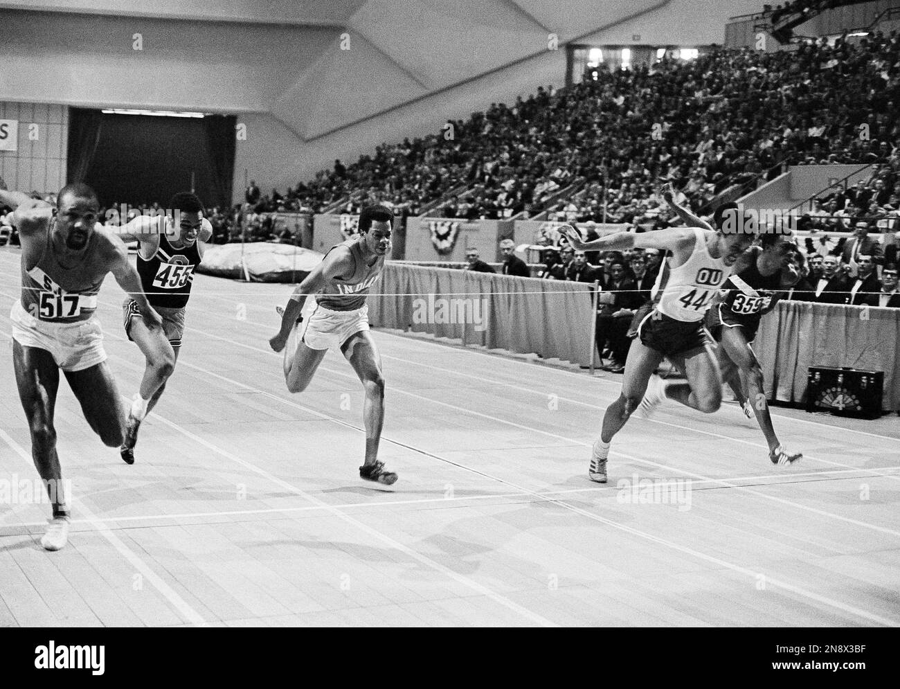 John Carlos of San Jose State, left, leans into the tape as he wins the ...