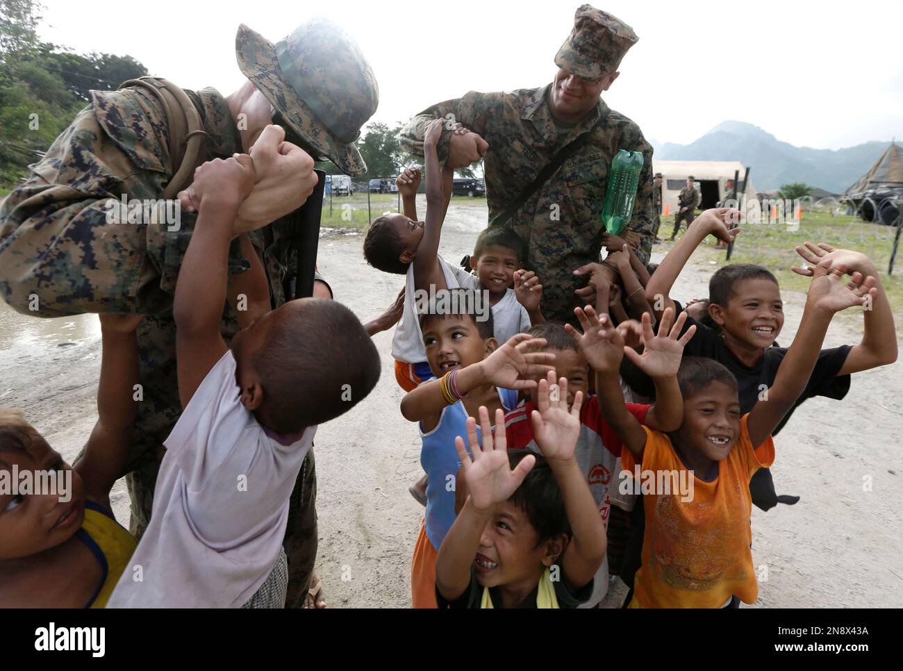 U.S. Marine LCPL Justin Tallo and CPL Brian Lippincott, left, both from ...