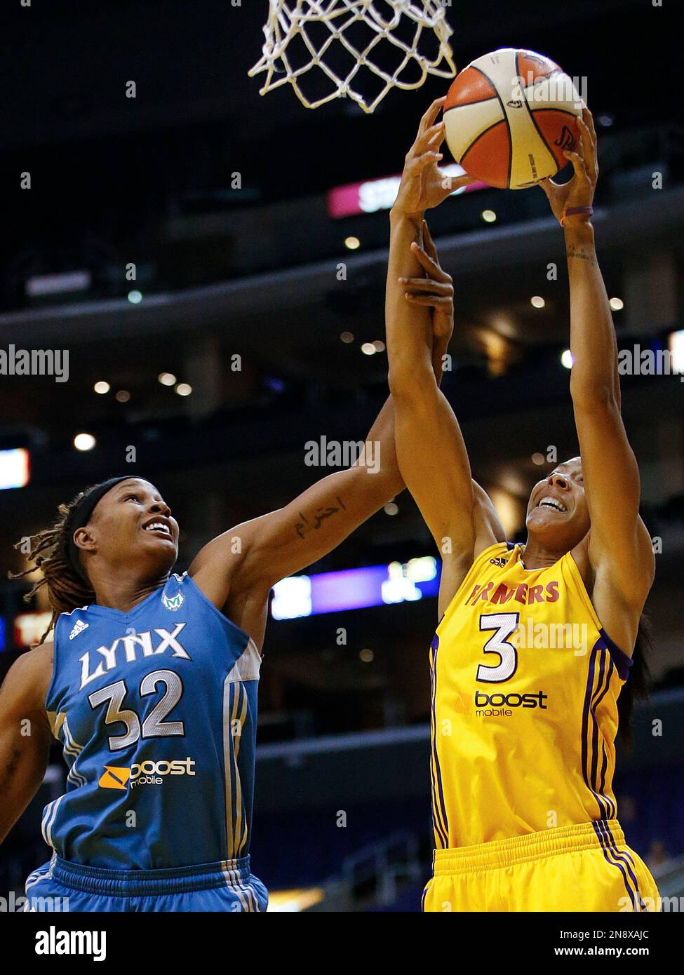 Los Angeles Sparks' Candace Parker, right, gets a rebound again ...