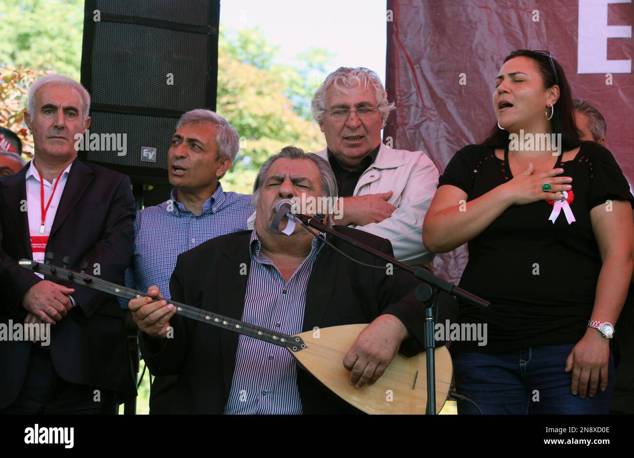 Arig Sag, famous Turkish singer and politician, front, and others sing ...