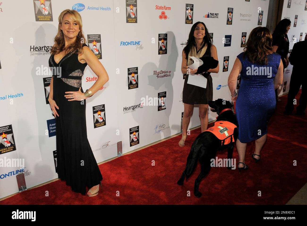 Actress Megyn Price, left, poses at the Hero Dog Awards at the Beverly ...