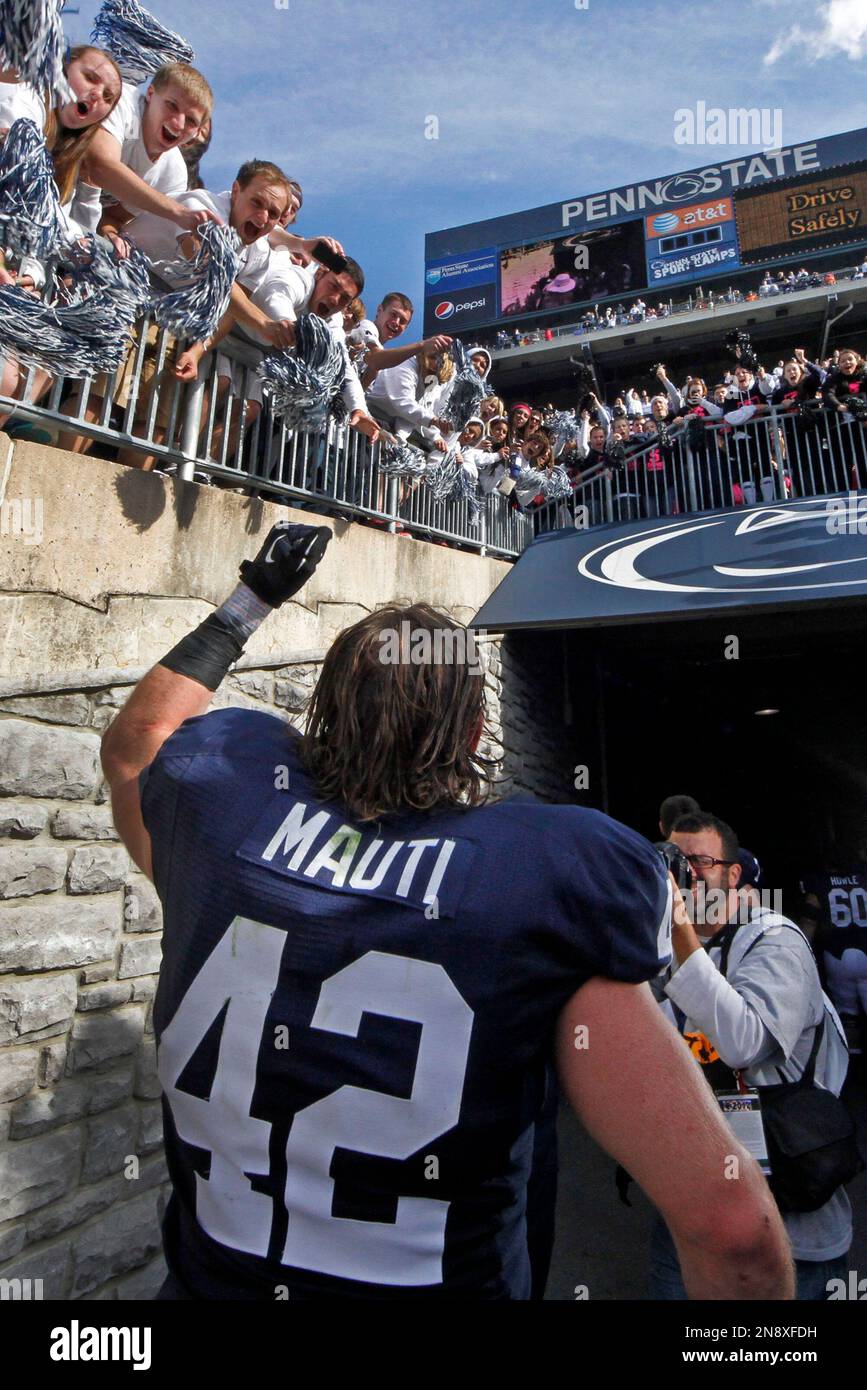 Penn State linebacker Michael Mauti (42) celebrates as he leaves the ...