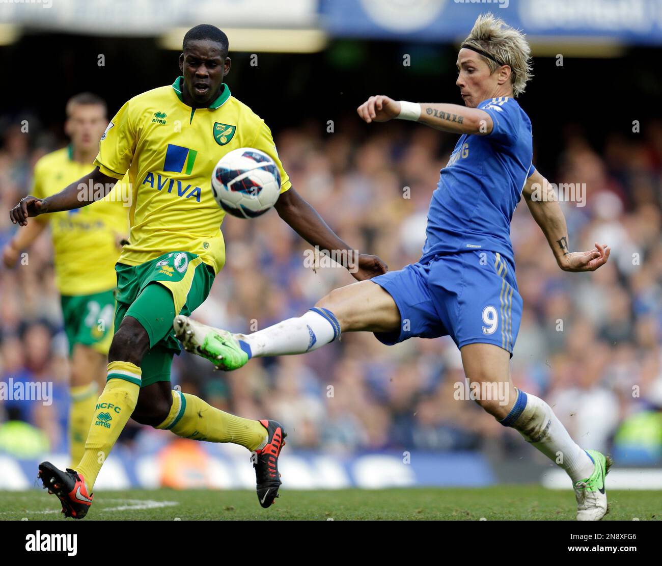 Chelsea's Fernando Torres, right, controls the ball past Norwich's Leon ...