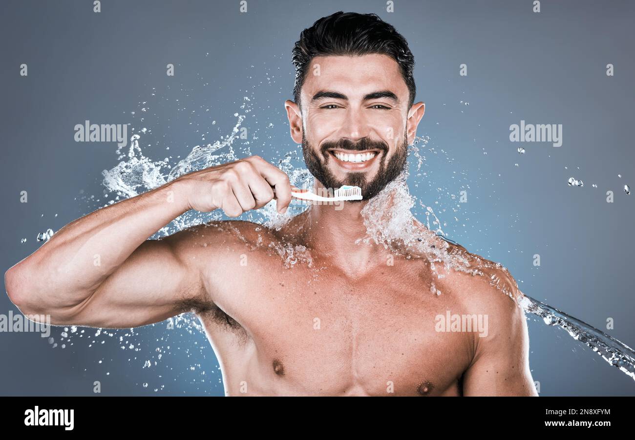 Water splash, brushing teeth and portrait of man with toothbrush, dental wellness and healthy ...