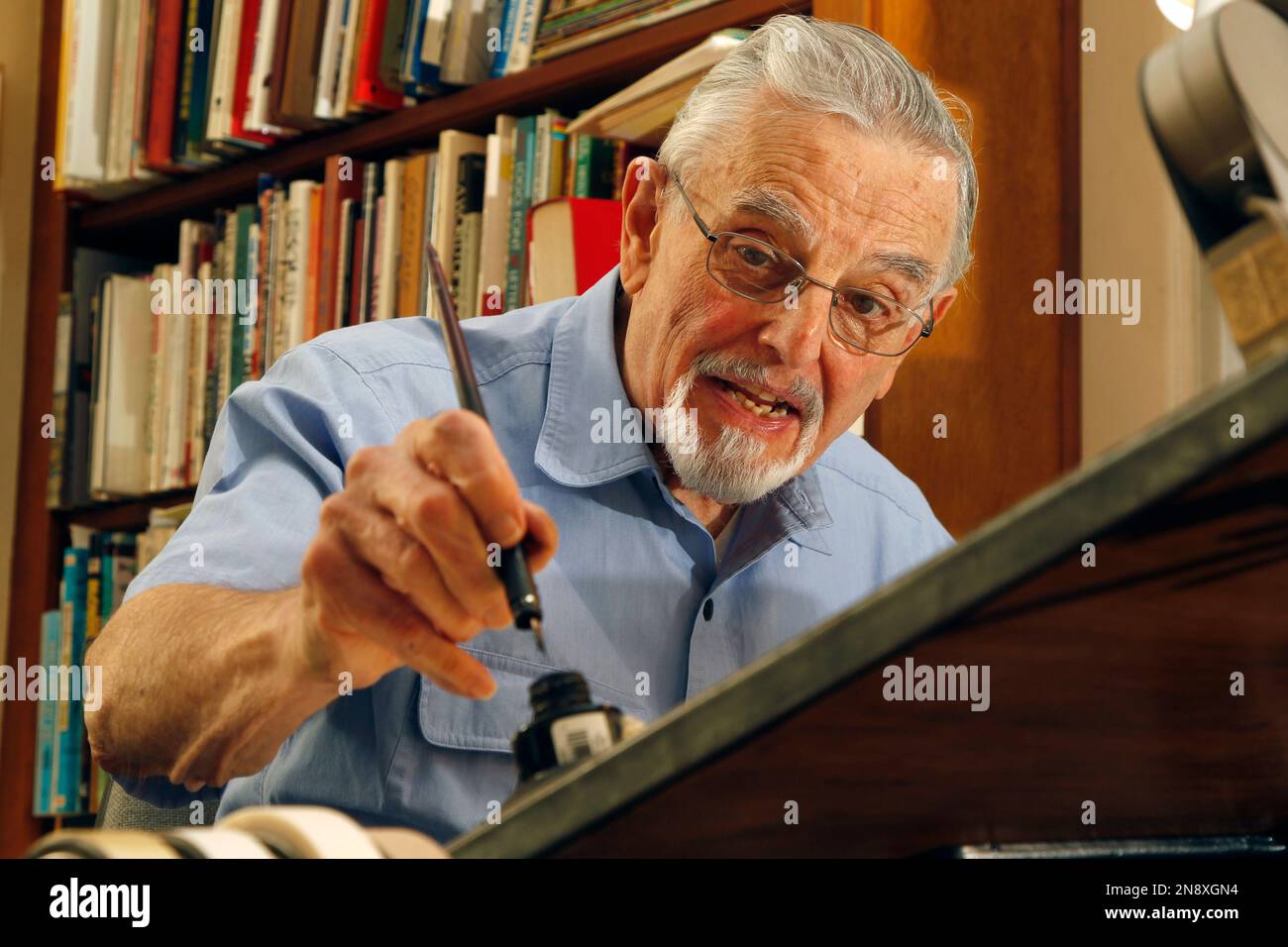 Hy Eisman, 85, works on deadline drawing a Popeye cartoon at his home ...