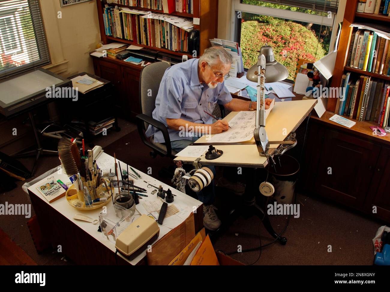 Hy Eisman, 85, works on deadline drawing a Popeye cartoon at his home ...
