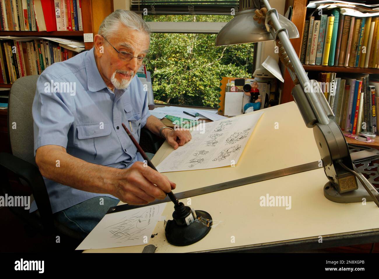 Hy Eisman, 85, works on deadline drawing a Popeye cartoon at his home ...