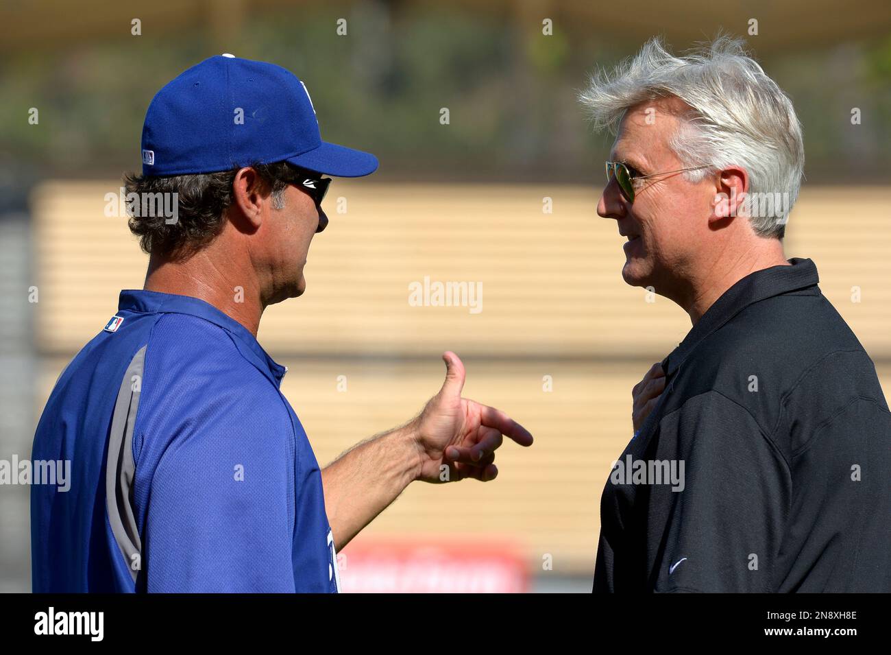 Los Angeles Dodgers manager Don Mattingly, left, talks with co-owner ...