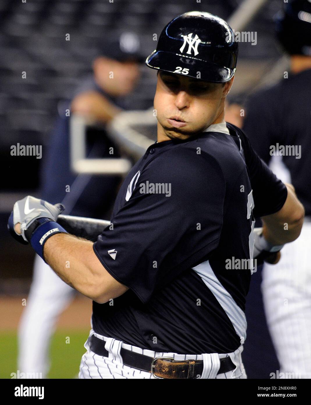 New York Yankees' Mark Teixeira loosens up during a baseball practice ...