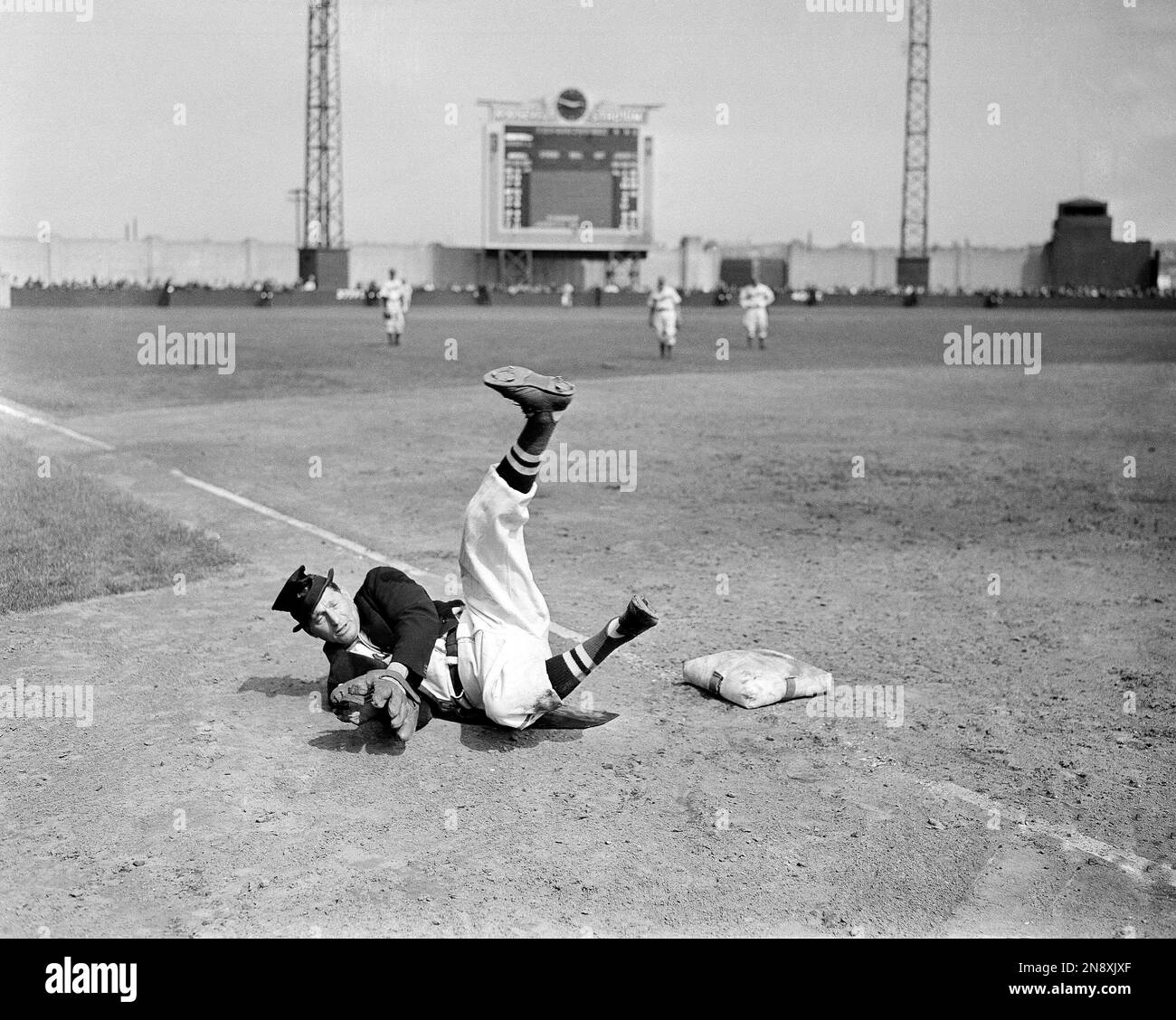 Baseball clown Al Schacht is shown with some of his props and parts of ...