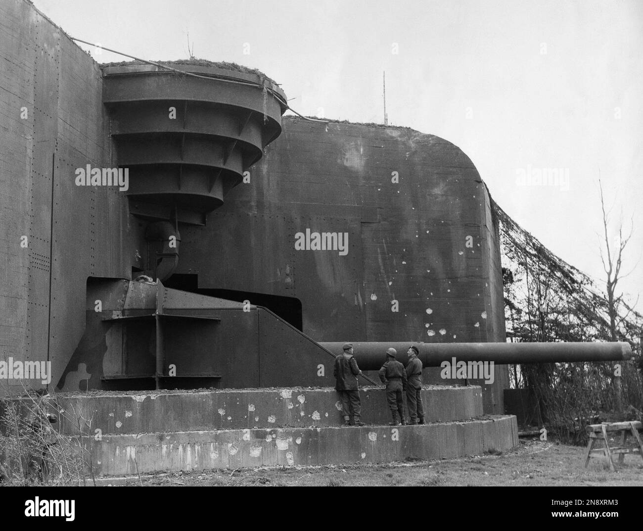 Photo shows gun after a sustained bombing attack of the German garrison ...