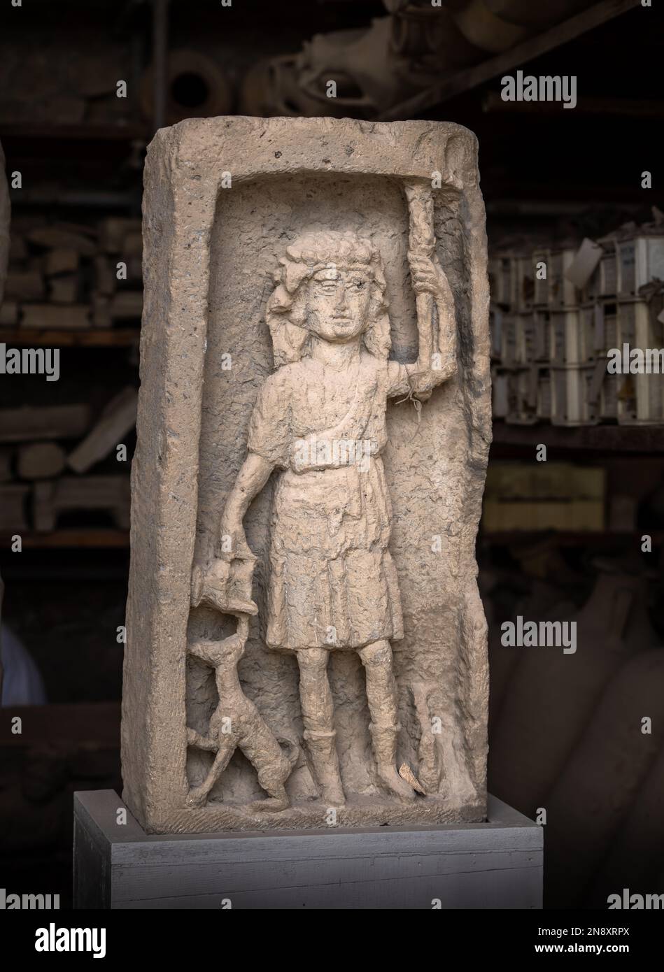 Excavated ancient roman carving in archeologic storeroom in Pompeii ...