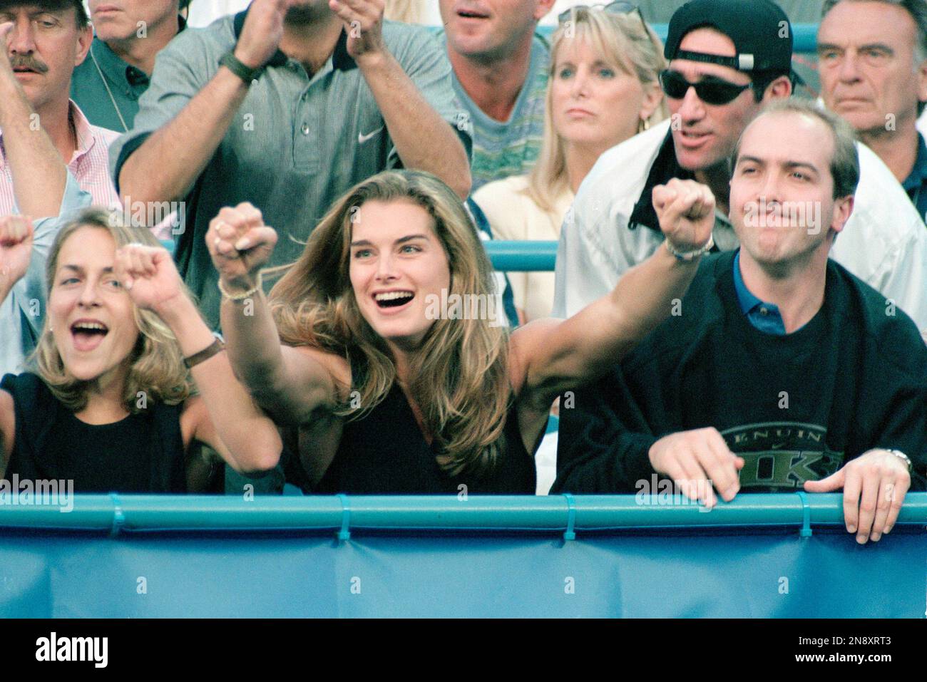 Actress/model Brooke Shields, center, reacts as Andre Agassi defeats ...