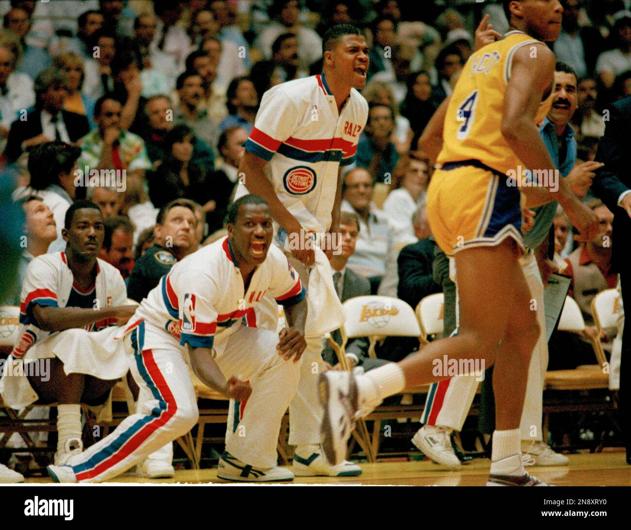 Detroit Pistons' Joe Dumars, left, seated, Walker D. Russell, center ...