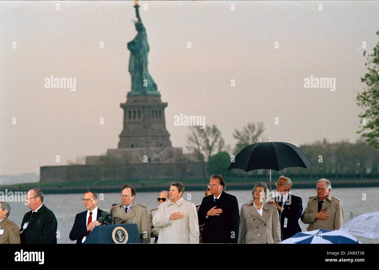 Standing for the National Anthem are, from left: Alvah Chapman, CEO of ...