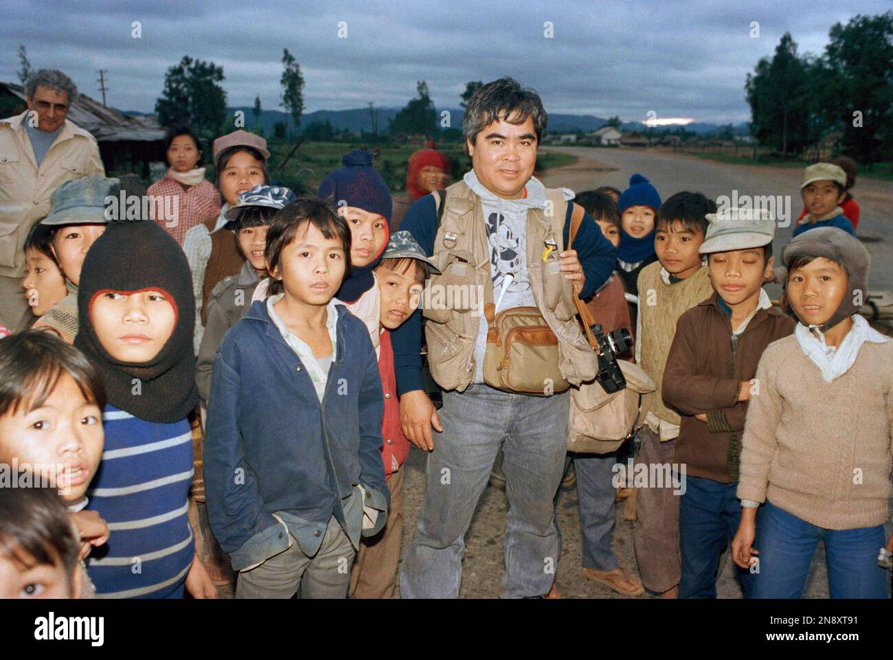 Nick Ut, center, and George Esper, upper left hand corner, on a ...