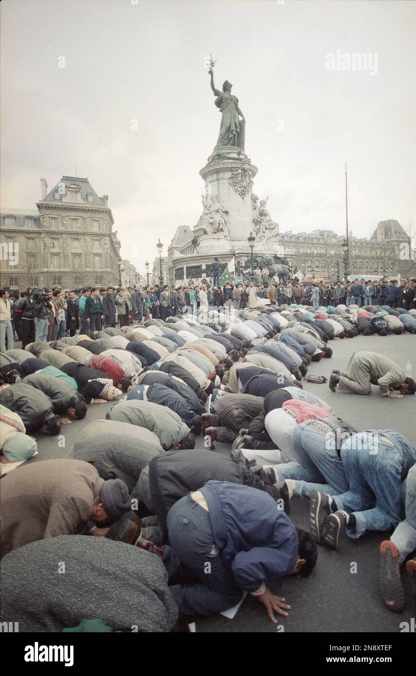 Muslims kneel and pray towards Mecca, in the Place de la Republique in ...