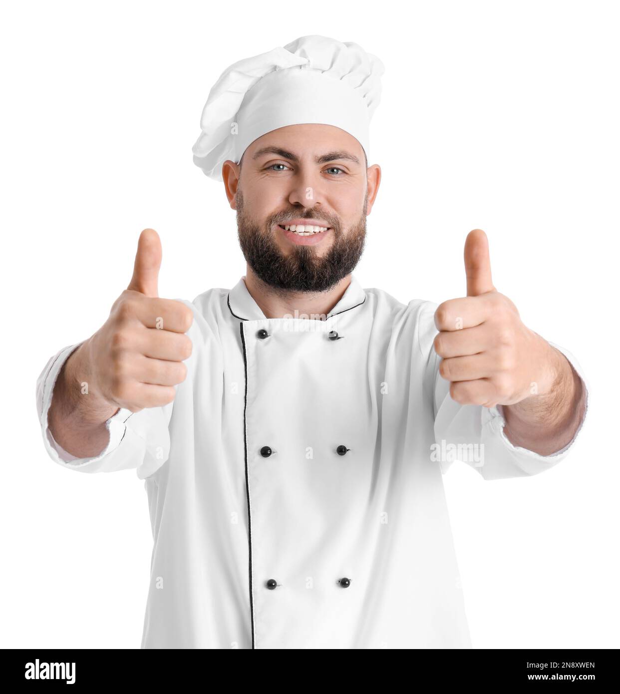 Male baker in uniform showing thumbs-up on white background Stock Photo ...
