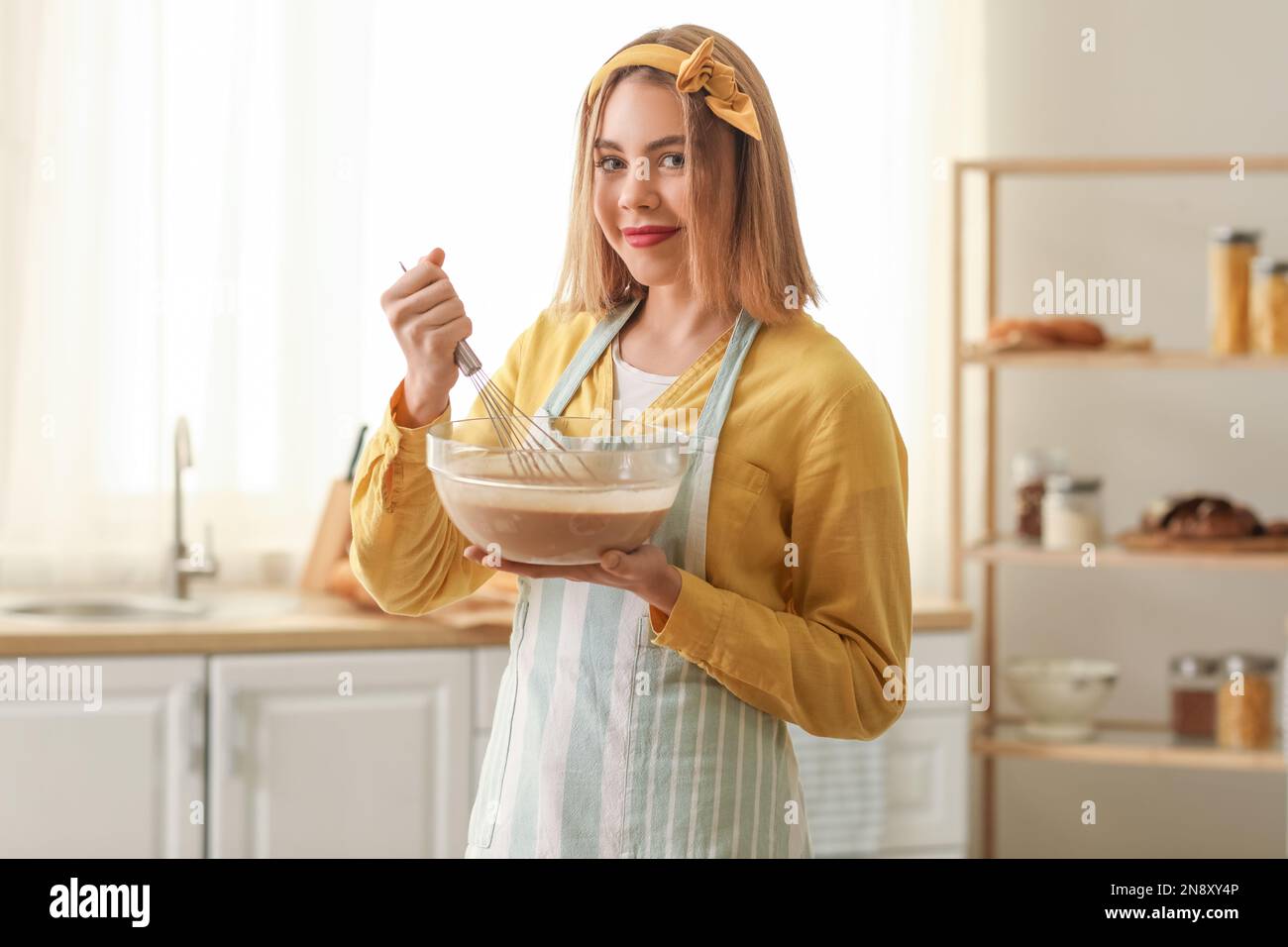 Female baker making dough in kitchen Stock Photo - Alamy