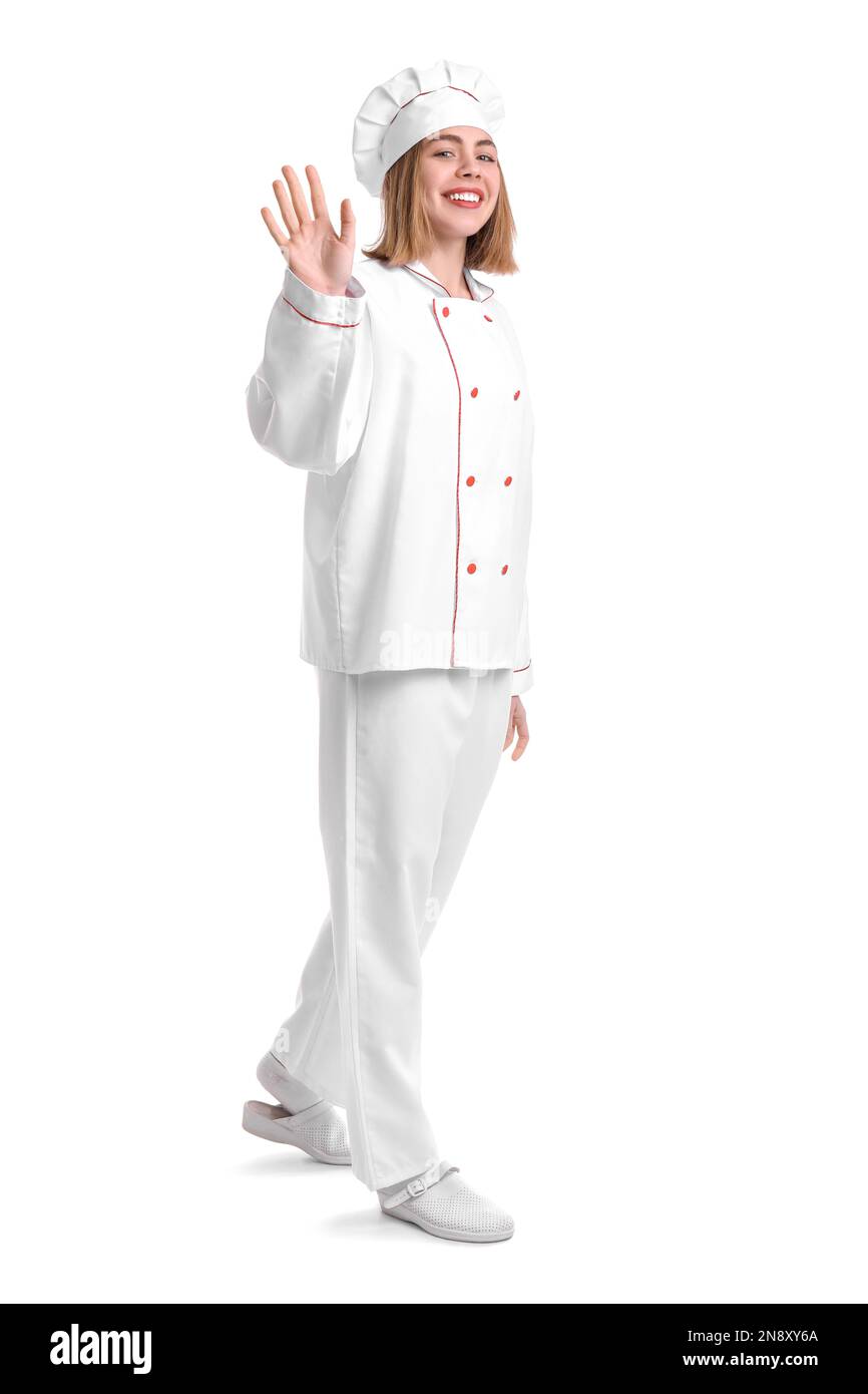 Female baker in uniform waving hand on white background Stock Photo - Alamy