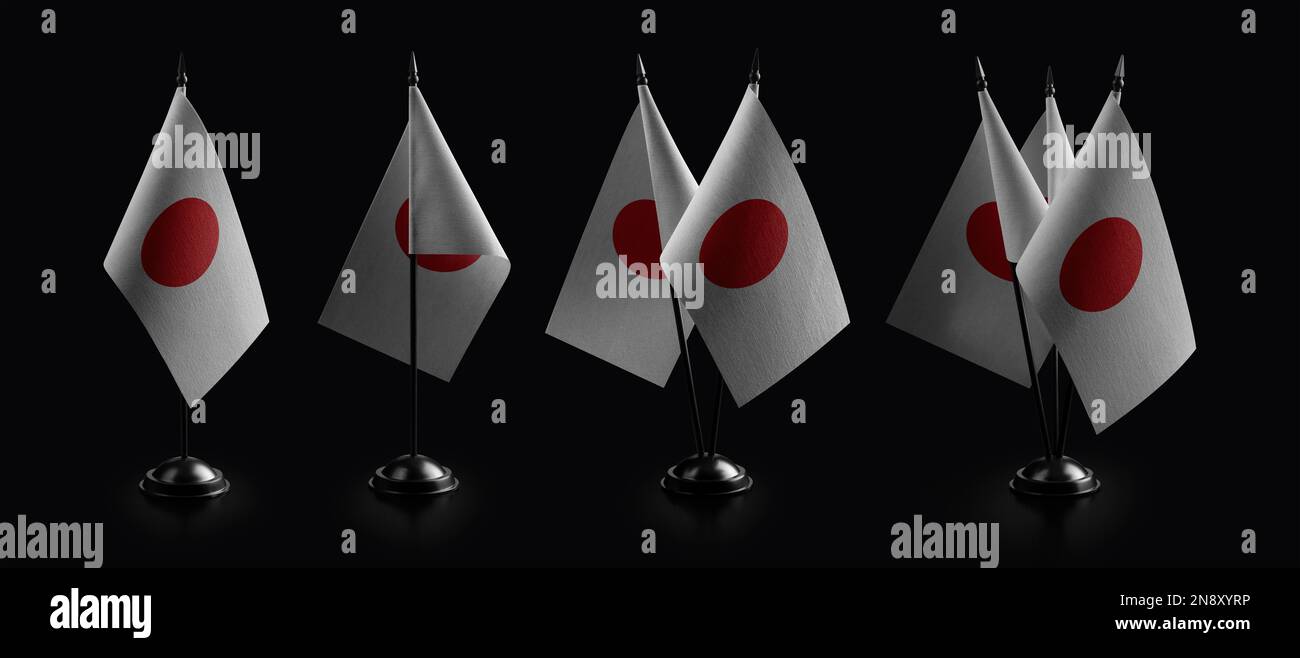 Small national flags of the Japan on a black background Stock Photo - Alamy