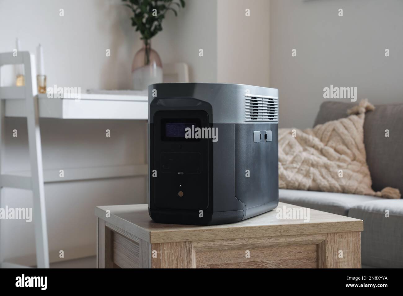 Portable power station on table in living room Stock Photo - Alamy