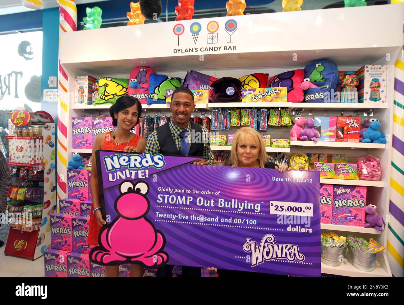 Nick Cannon, center, joins Natasha Madan, Wonka Marketing Manager, left ...