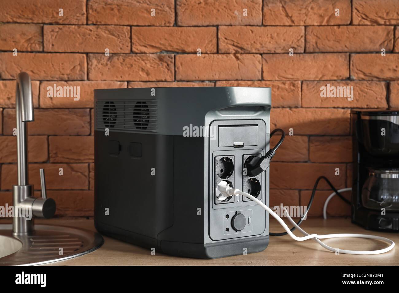 Portable power station on counter in kitchen Stock Photo - Alamy