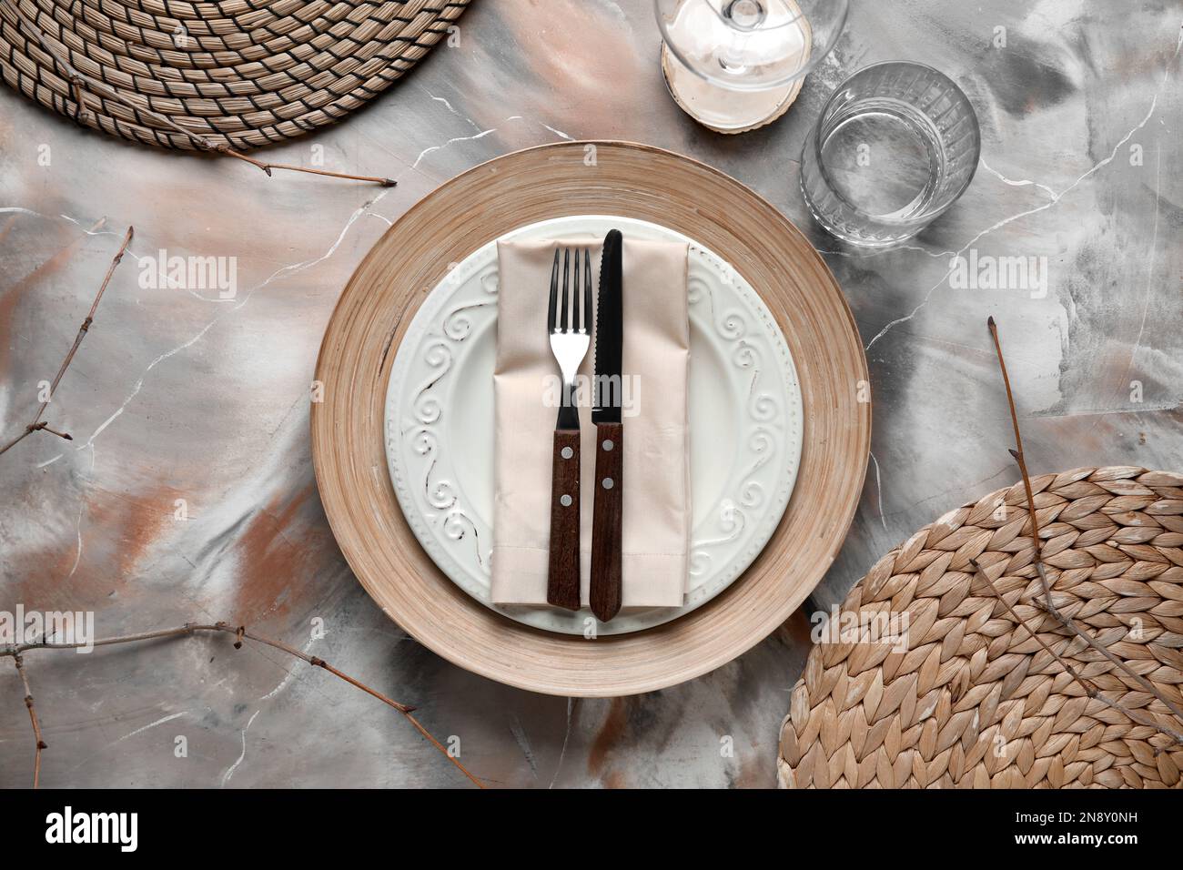 Beautiful table setting with plates and cutlery on grunge background ...