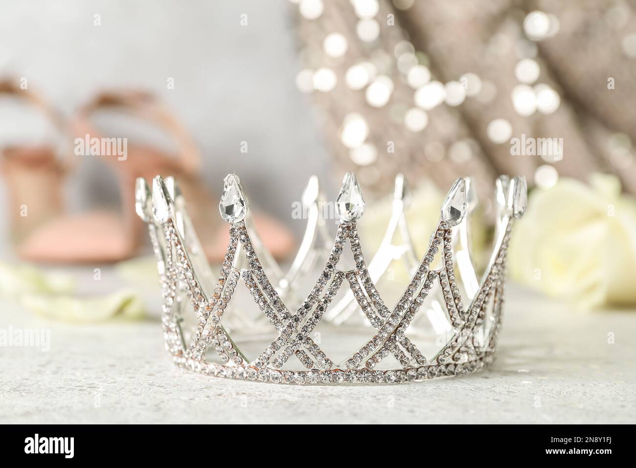 Beautiful tiara on white table, closeup. Prom concept Stock Photo - Alamy