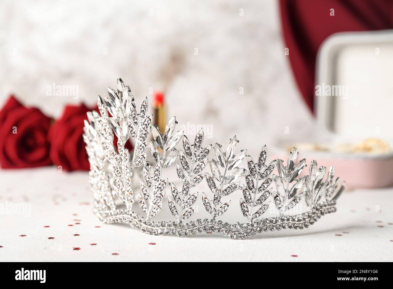 Beautiful tiara on white table, closeup. Prom concept Stock Photo - Alamy