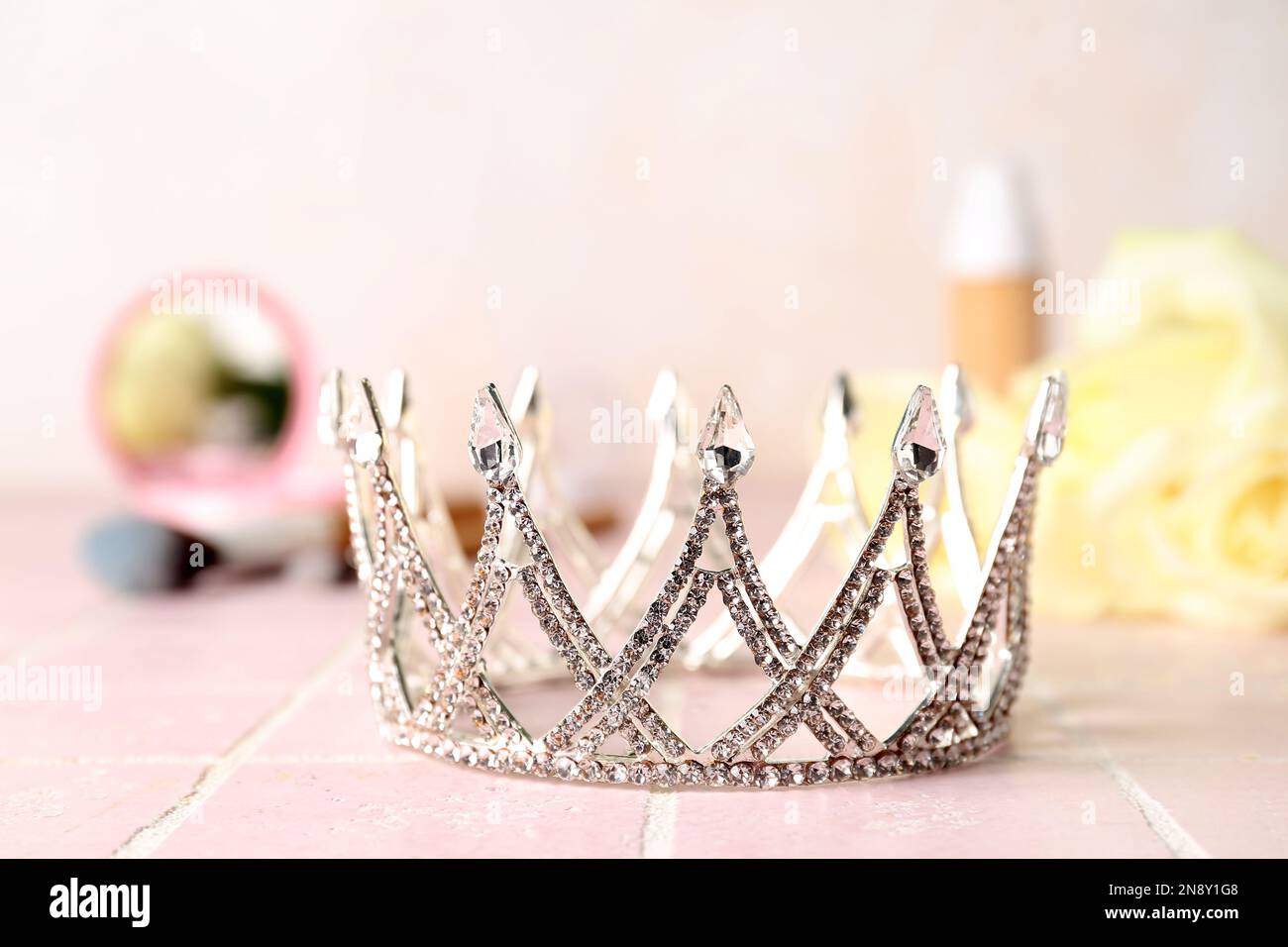 Beautiful tiara on pink tile table, closeup. Prom concept Stock Photo ...