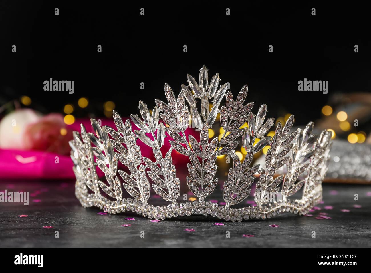 Beautiful tiara on dark table, closeup. Prom concept Stock Photo - Alamy
