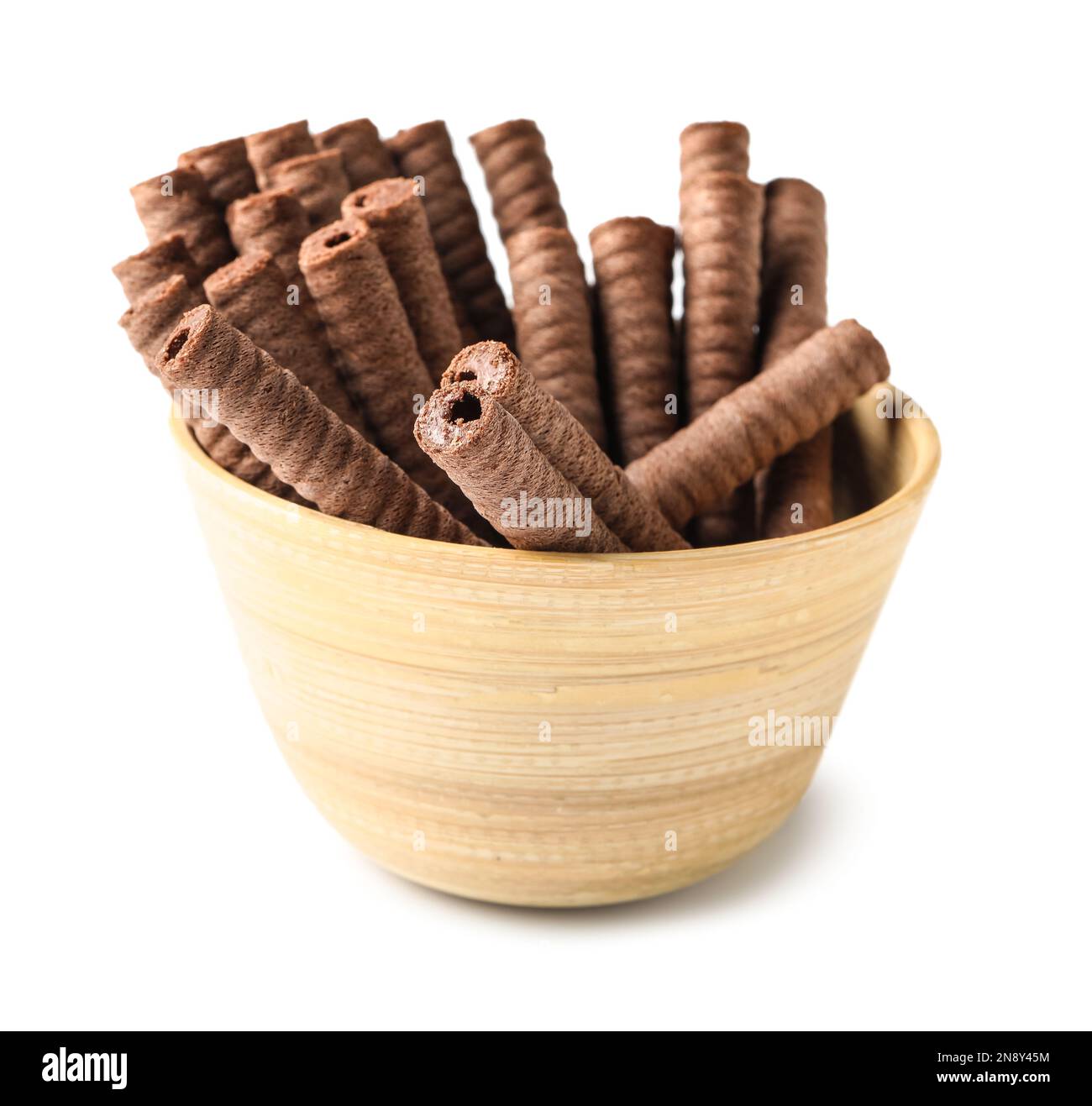 Bowl with delicious chocolate wafer rolls isolated on white background ...