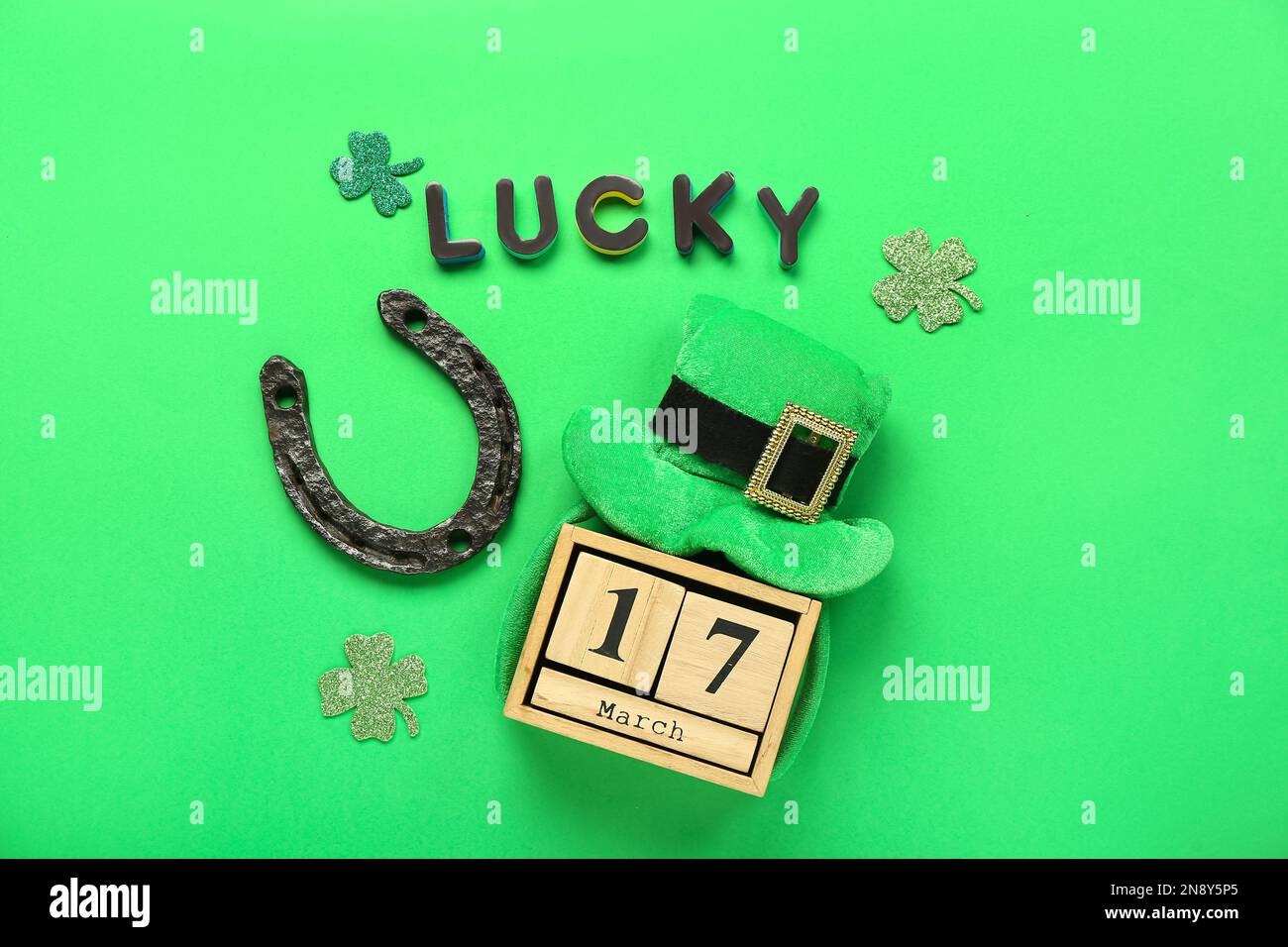 Calendar with date of St. Patrick's Day, Leprechaun hat, horseshoe and ...
