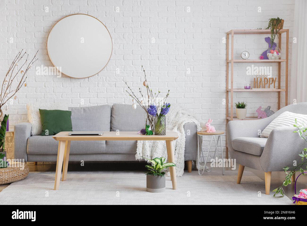 Interior of living room with sofa, armchair and Easter decor Stock ...
