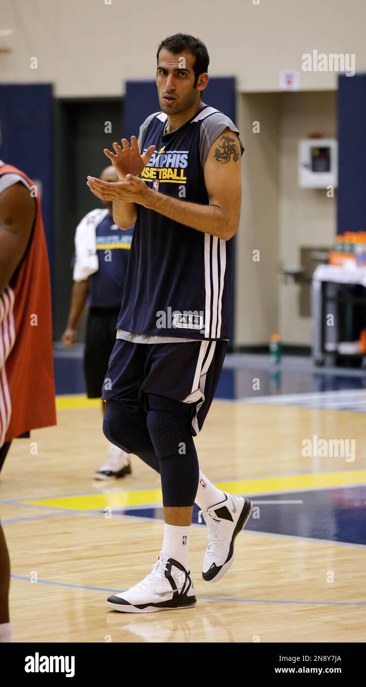 Memphis Grizzlies center Hamed Haddadi walks across the court during ...