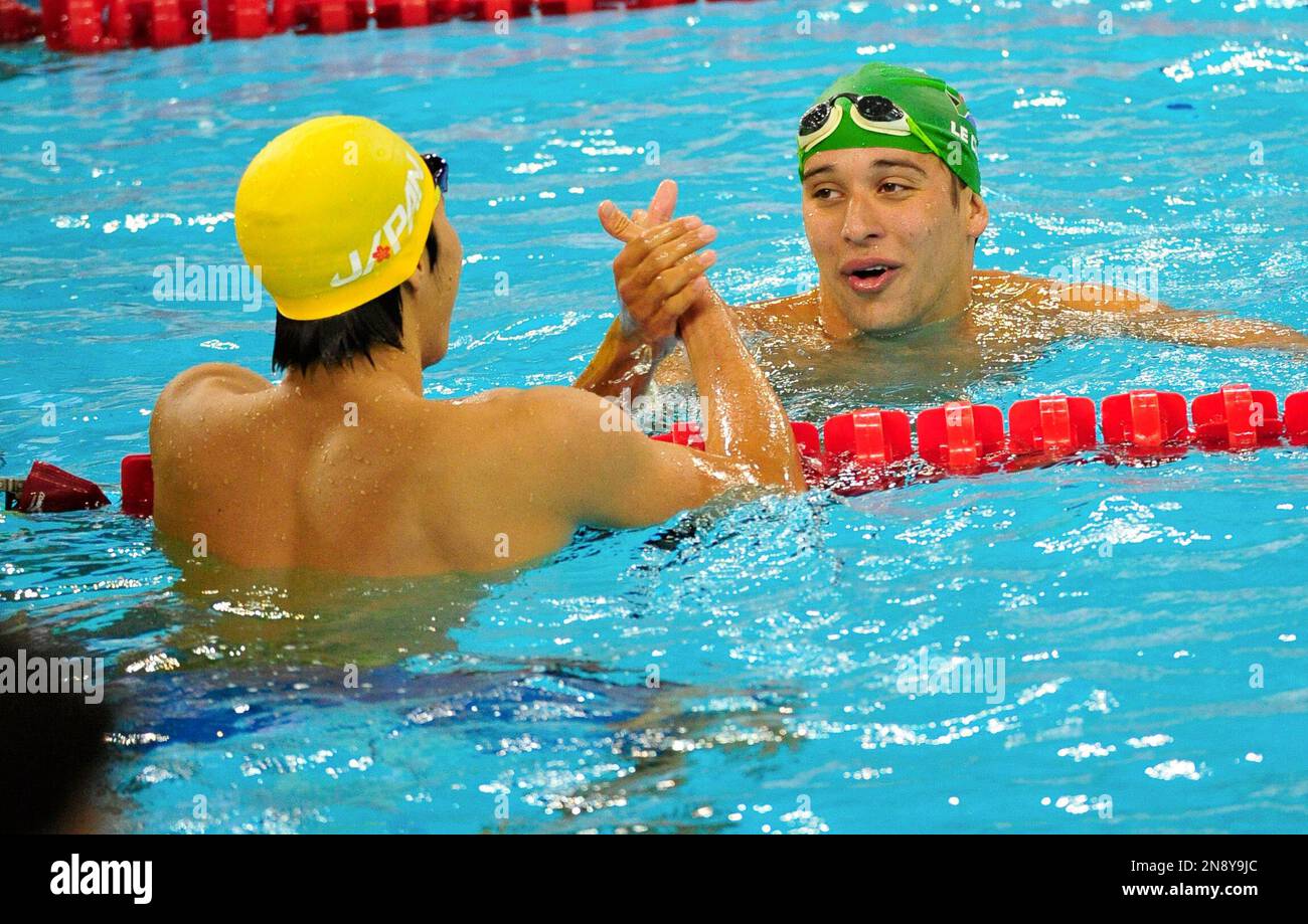 Daiya Seto of Japan, left, and Chad le Clos of South Africa react after ...