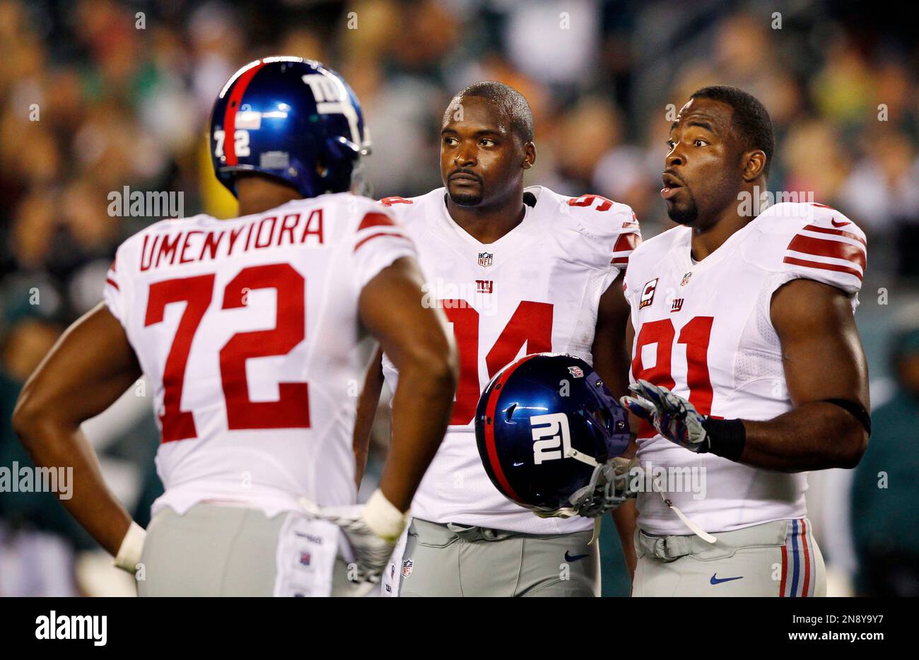New York Giants defensive end Justin Tuck (91), defensive end Osi ...