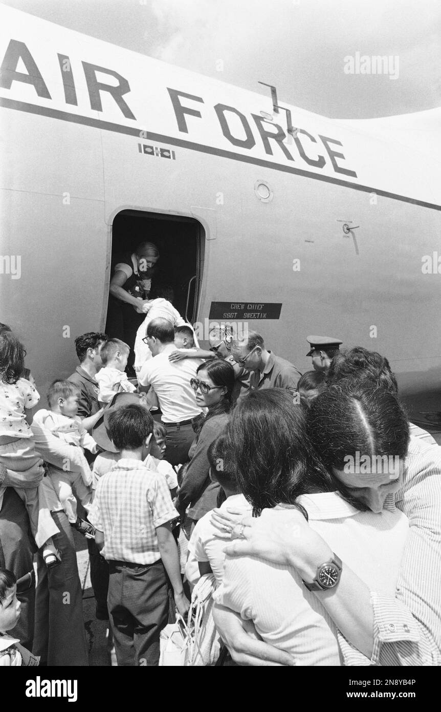 Actress Ina Balin, foreground, puts comforting arms around a Vietnamese ...