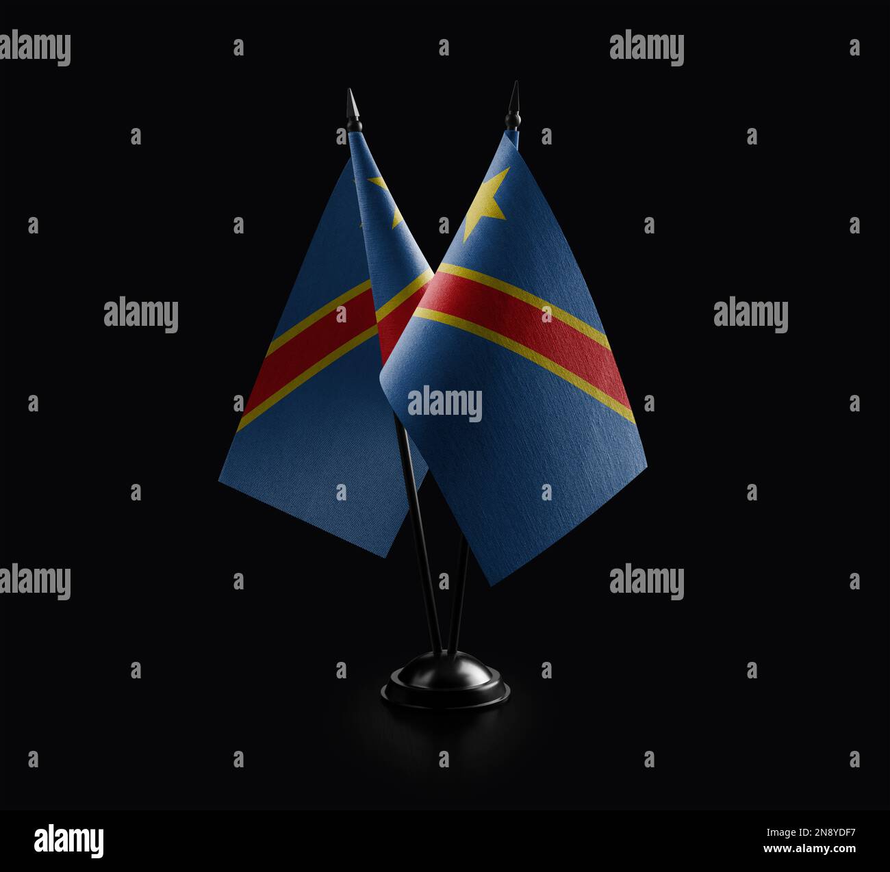 Small national flags of the Democratic Republic of the Congo on a black ...
