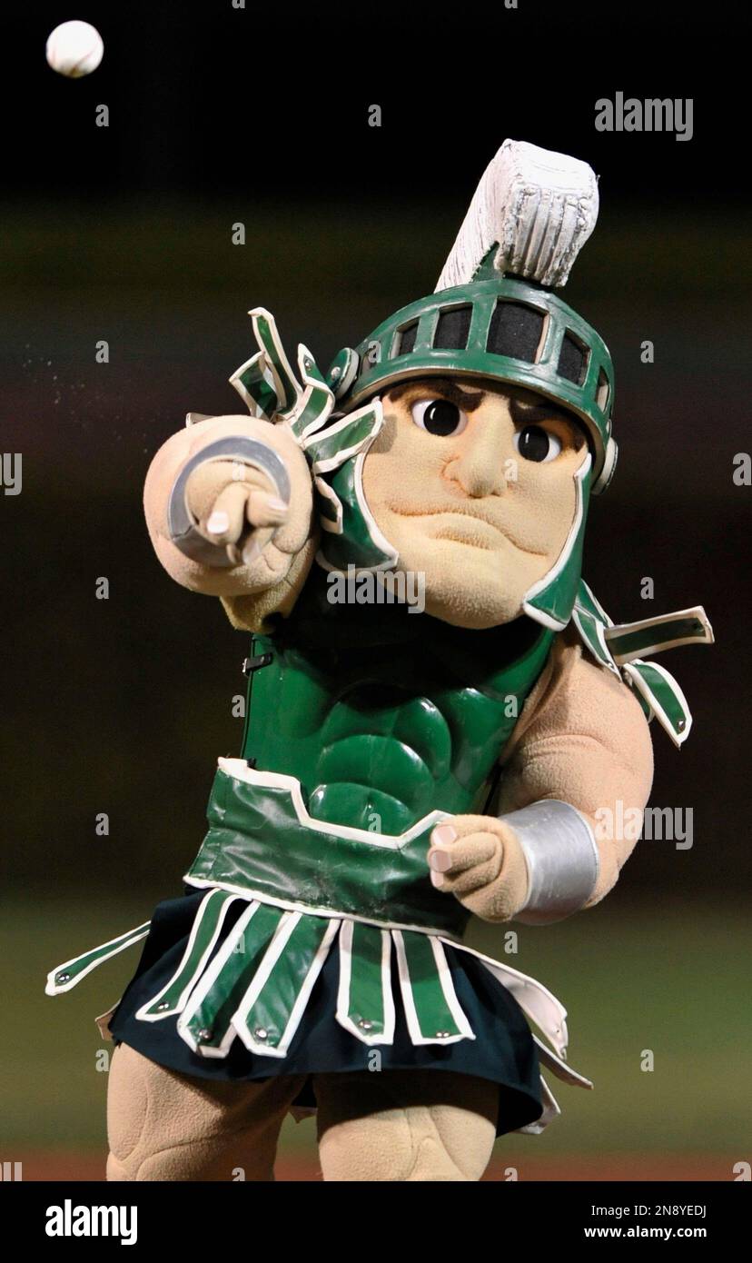 The Michigan State University mascot "Sparty" throws out the ceremonial ...