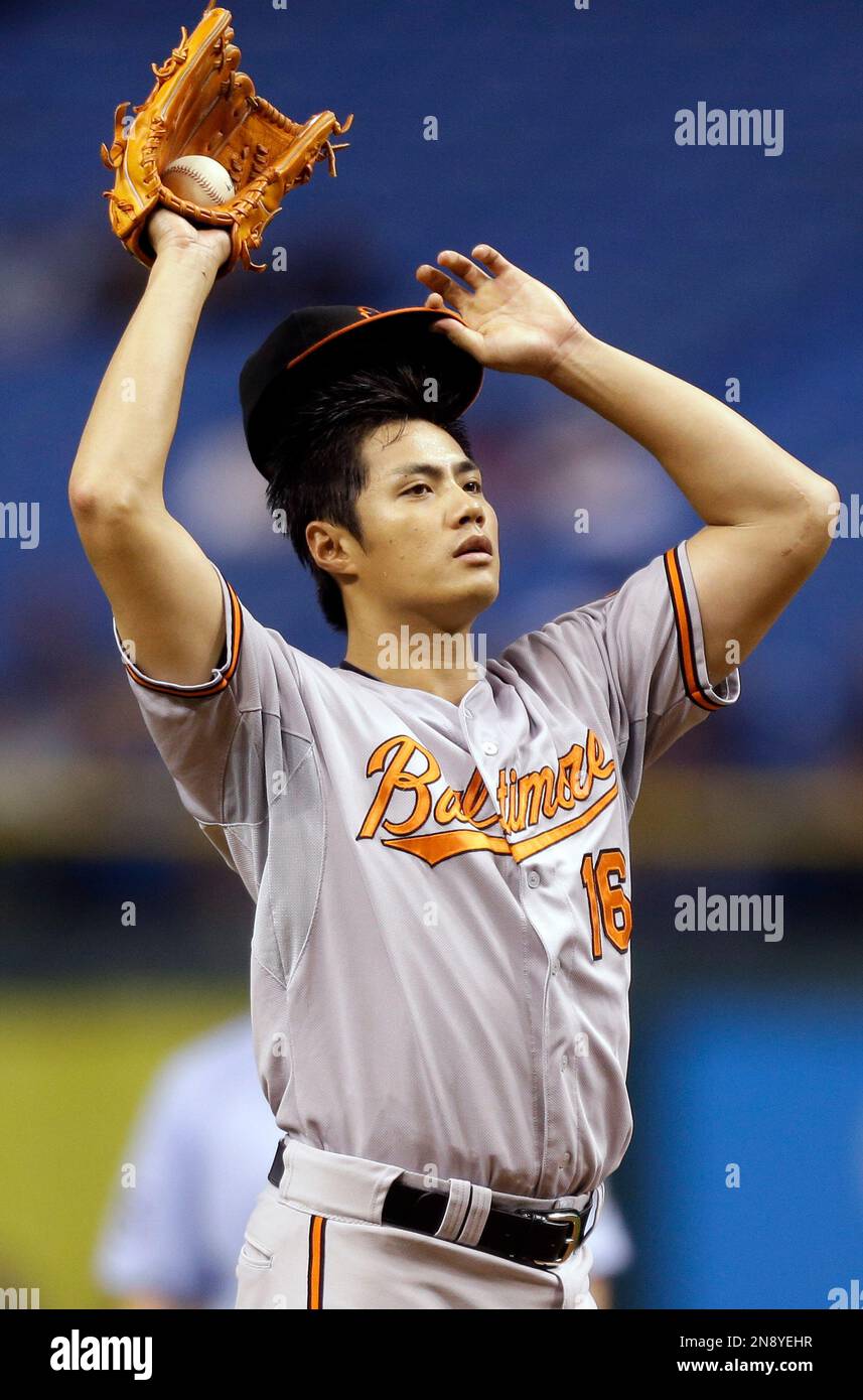 Baltimore Orioles starting pitcher Wei-Yin Chen, of Taiwan, reacts ...